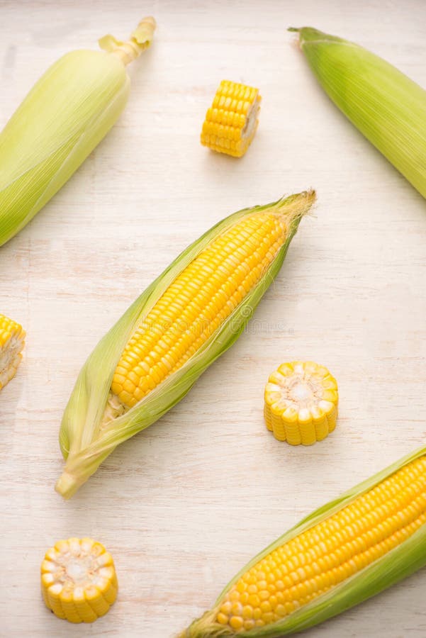 Sweet Corns. Fresh Corn on Cobs on Wooden Table. Stock Photo - Image of ...