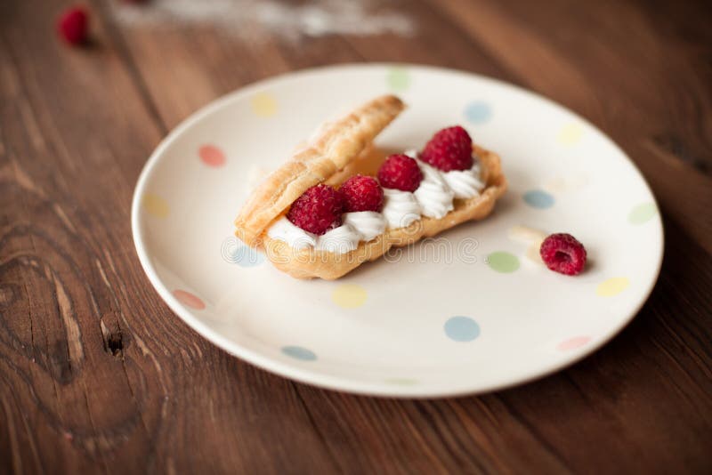 Sweet Dessert with Fresh Raspberries on Plate on Wood Table Stock Image ...