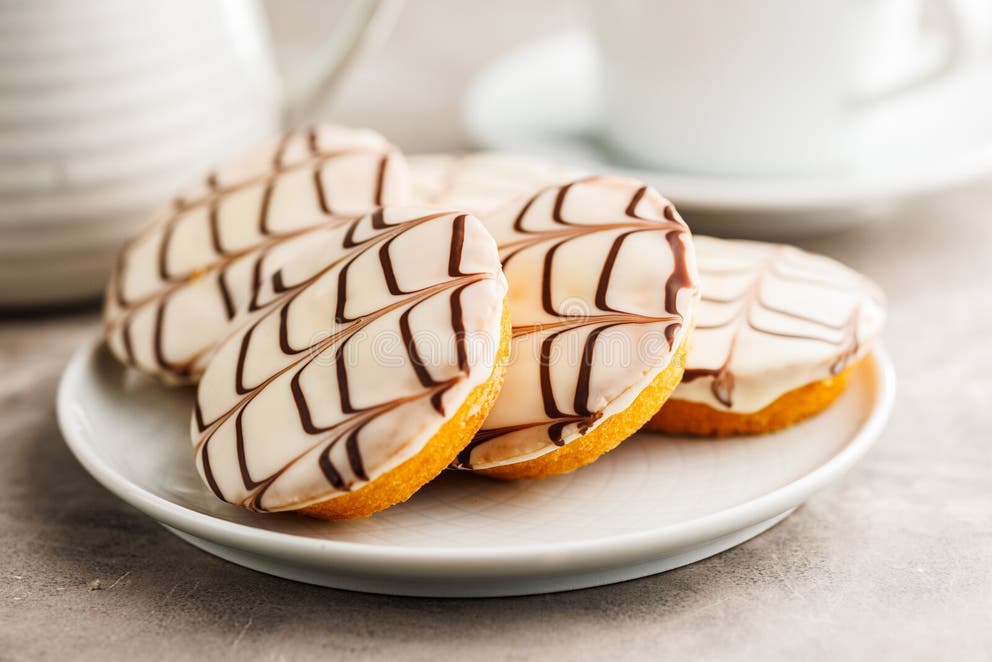 Sweet Dessert with Sugar Coating on Plate on Kitchen Table Stock Photo ...