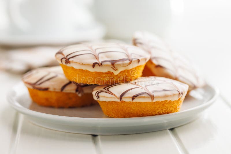 Sweet Dessert with Sugar Coating on Plate on White Table Stock Image ...