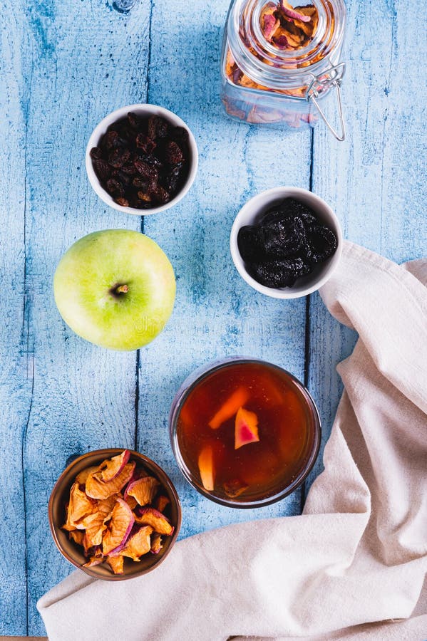 Sweet Dried Fruit Compote in a Glass on the Table Top and Vertical View ...