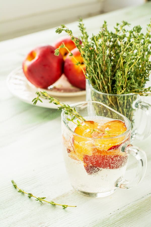 Sweet Fizzy Drink with Peach Slices and Thyme on a Stock Photo - Image ...