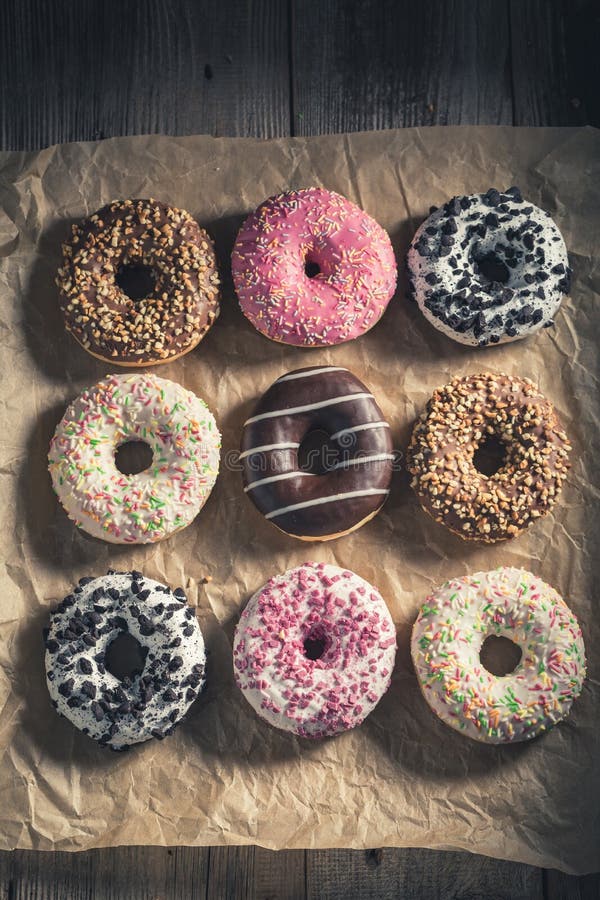 Sweet and Fresh Donuts on Wooden Table Stock Photo - Image of delicious ...