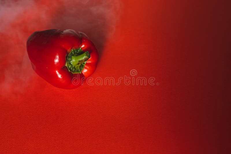 SWEET, Fresh RED PEPPER on a RED BACKGROUND with a LIGHT SMOKE. Stock ...