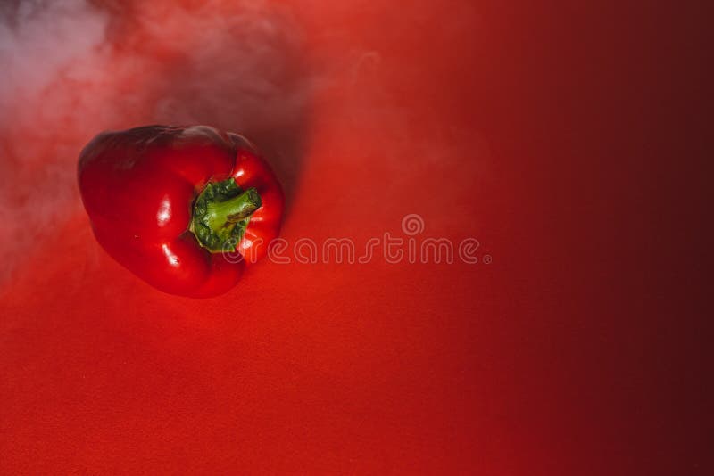 SWEET, Fresh RED PEPPER on a RED BACKGROUND with a LIGHT SMOKE. Stock ...