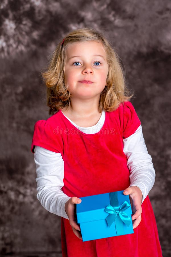 Sweet girl with present stock photo. Image of cute, holiday - 63642014