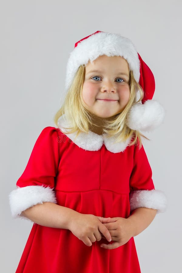 Girl in a Red New Year Cap with a Celebratory Gift Stock Photo - Image ...