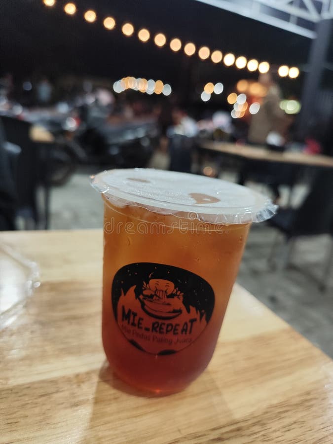 Sweet Iced Tea in a Plastic Cup Served in a Cafe. Editorial Photography ...