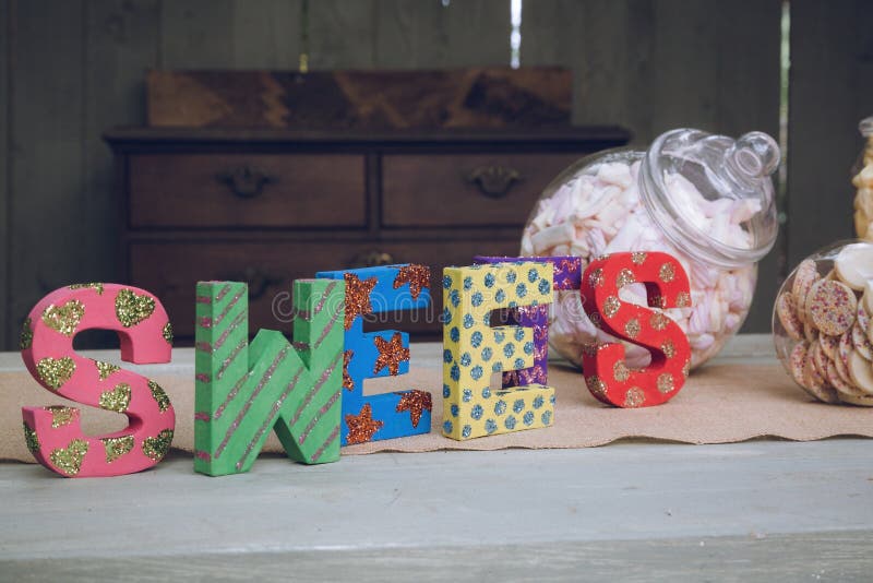 Sweet Jars Filled with Retro Sweets Next To a Sign Reading Sweets Stock ...