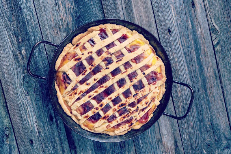 Sweet pie in iron pan stock image. Image of table, baked - 142832737