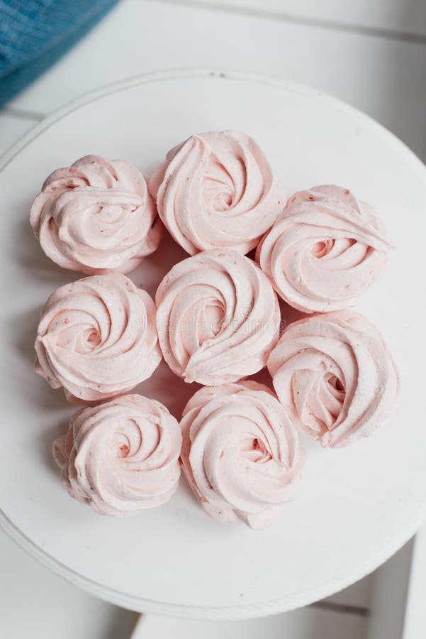 Sweet Pink Meringue on a White Plate on the Table Stock Image - Image ...