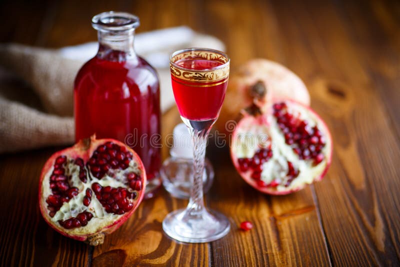Sweet Pomegranate Alcoholic Cordial in the Decanter with a Glass Stock ...