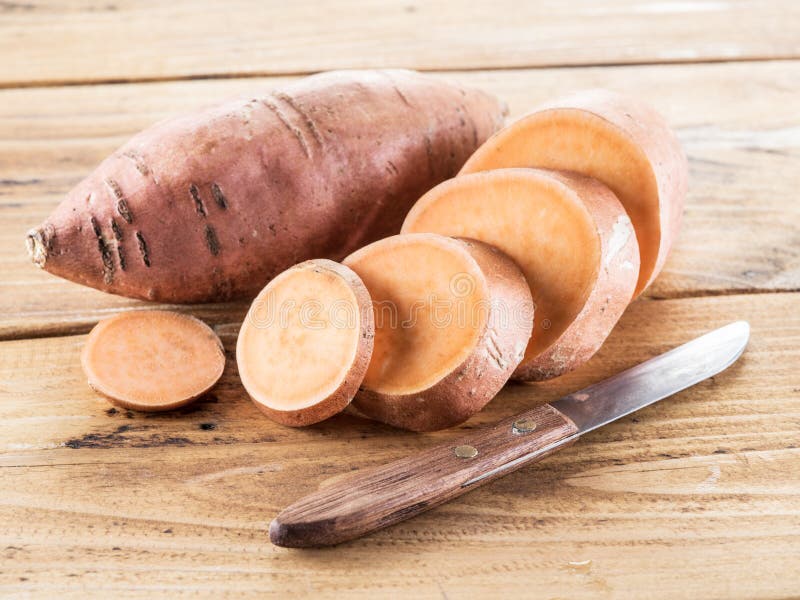 Sweet Potatoes on the Old Wooden Table Stock Photo - Image of potato ...