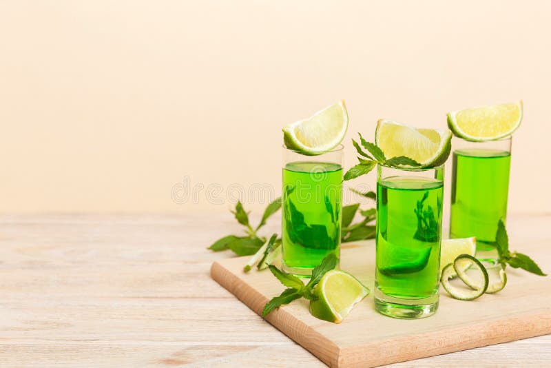 Sweet Refreshing Mint Liqueur, with Ice and Mint Leaves on Table ...