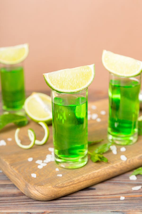 Sweet Refreshing Mint Liqueur, with Ice and Mint Leaves on Table ...