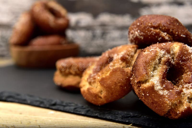 Sweet Spanish Doughnuts on a Black Slate Plate Stock Photo - Image of ...