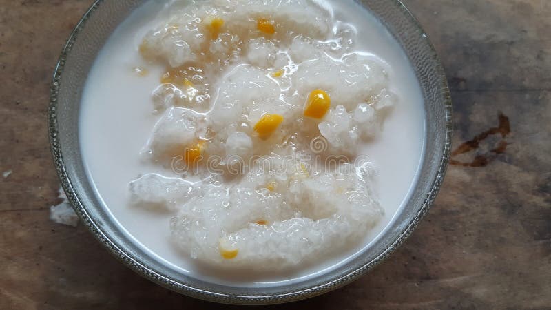 Sweet Sticky Rice with Corn and Coconut Cream on Wood Table. Stock ...