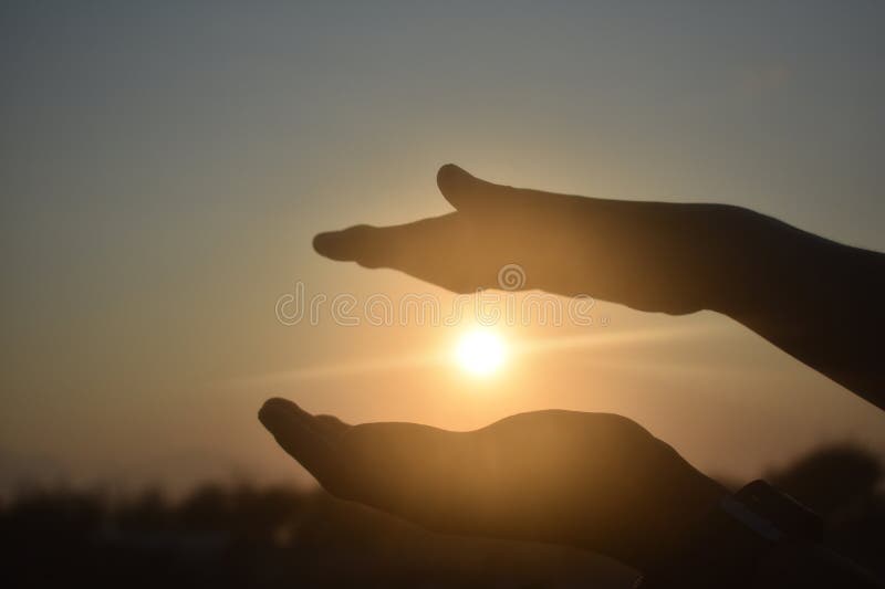 Sweet Sunset between Two Hands on the Beach Stock Photo - Image of ...