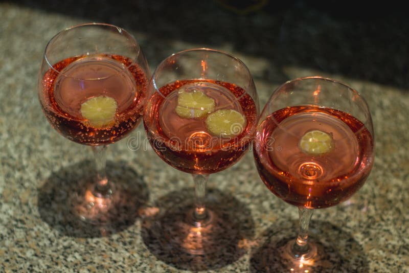 Sweet Tasty Red Juice in Glasses with Sliced Lemons on a Patterned ...