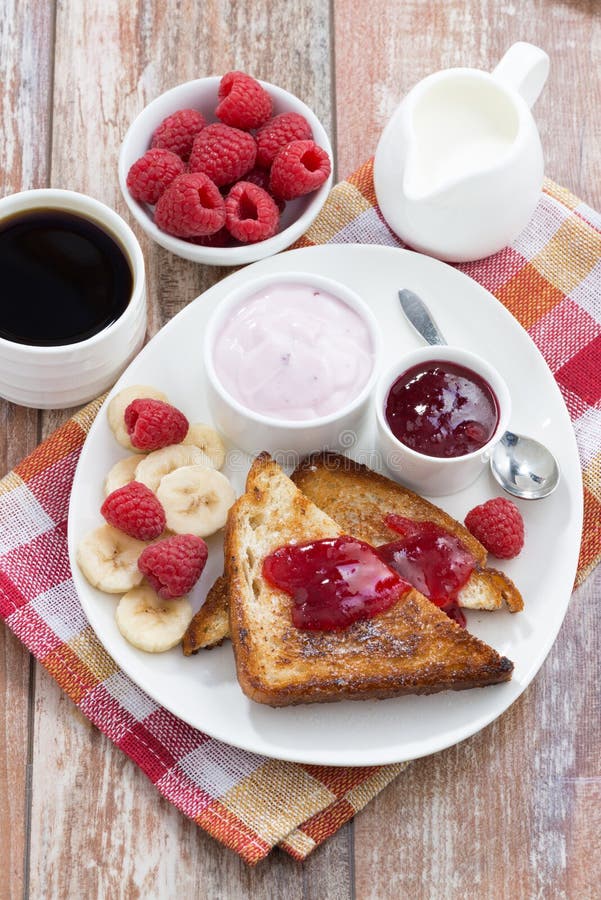 Sweet Toasts with Fresh Raspberry, Jam and Yoghurt for Breakfast Stock ...