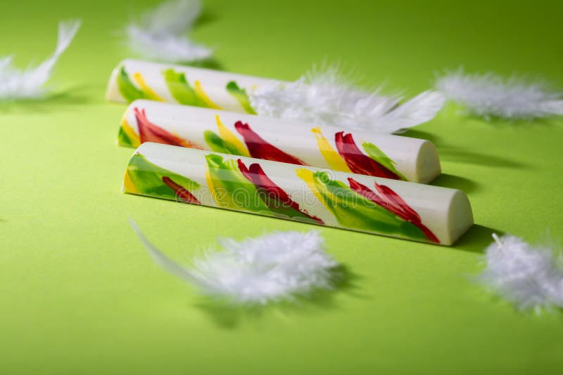 Sweet White Chocolate Candies on Green Surface Stock Photo - Image of ...