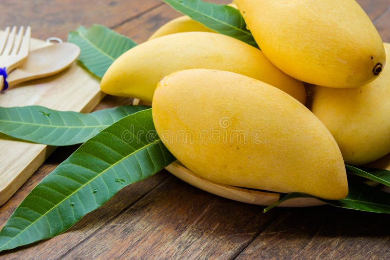 Sweet Yellow Mango Fruit on Summer on Wood Table Stock Photo - Image of ...
