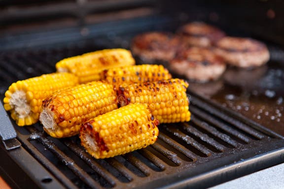 Sweetcorn Cooking on a Barbecue Stock Image - Image of people, colour ...