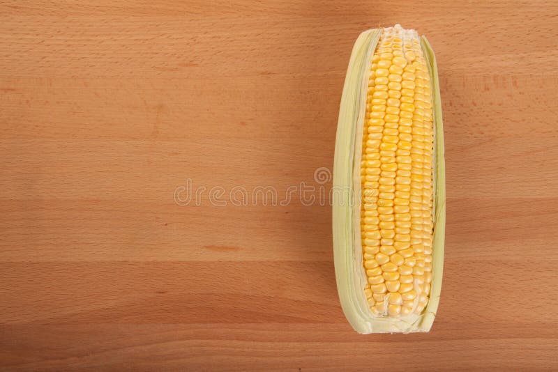 Sweetcorn on wooden table stock photo. Image of fresh - 52111196