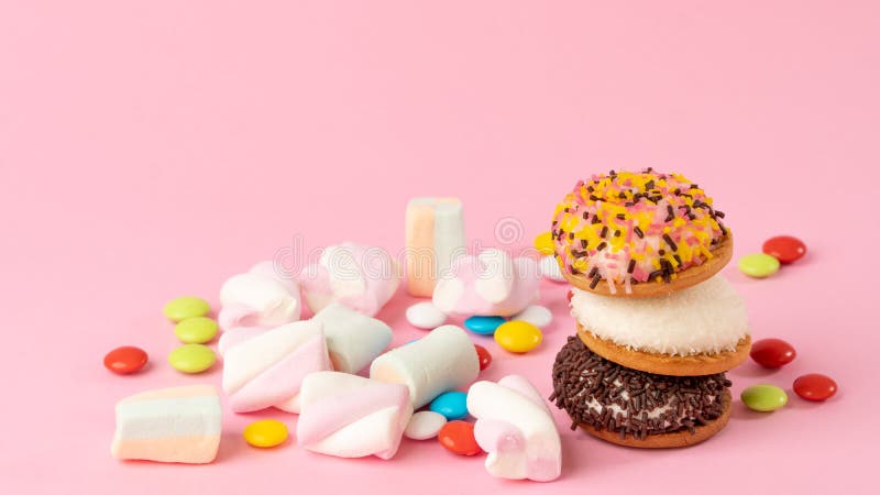 Sweets - Cake, Sweets, Dragees, Marshmallows on a Pink Background Stock ...
