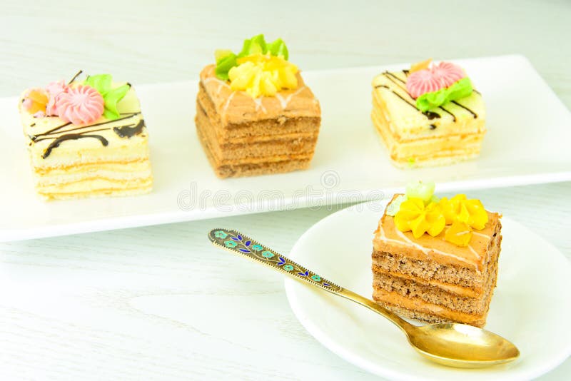 Sweets: Cream Cakes on Plate Stock Photo - Image of cake, dessert: 62971016
