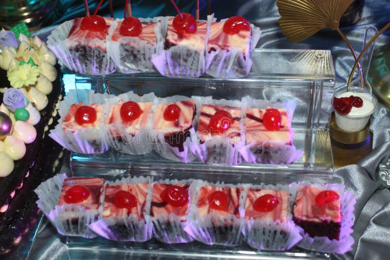 Sweets Cupcakes Layer Table on White Linen with a Beautiful Event ...