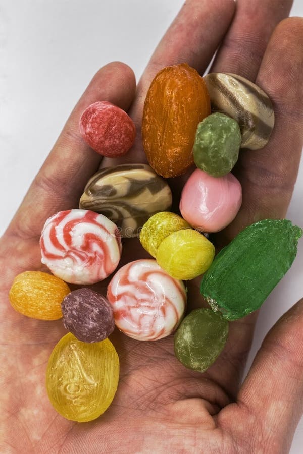 Sweets - hand of candy stock image. Image of white, colorful - 86381479