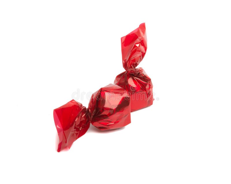 Sweets in red foil stock image. Image of background - 114259191