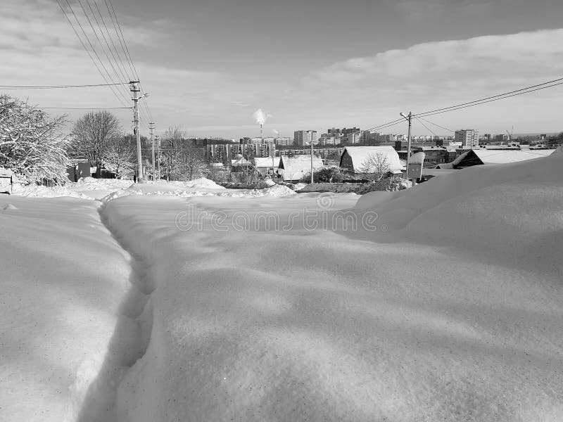 Swept snowy road and city stock photo. Image of view - 139766730