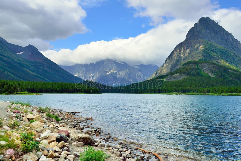 Swiftcurrent Lake in Glacier National Park Stock Photo - Image of ...