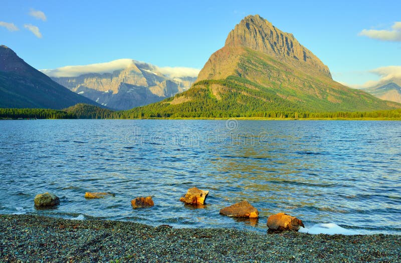 Swiftcurrent Lake in Glacier National Park Stock Photo - Image of river ...