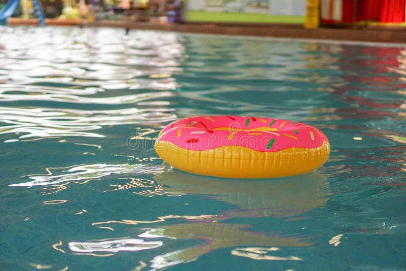 Swim Ring Floating on Blue Water with an Airy Wave Reflection. Stock ...