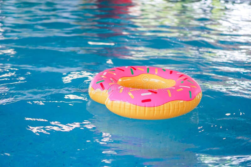 Swim Ring Floating on Blue Water with an Airy Wave Reflection in Stock ...