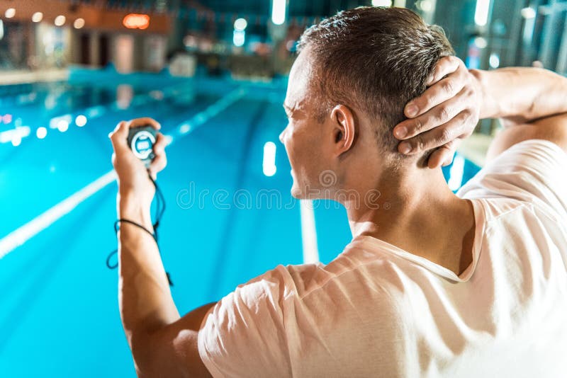Handsome Swim Trainer with Timer Standing at Competition Stock Image ...