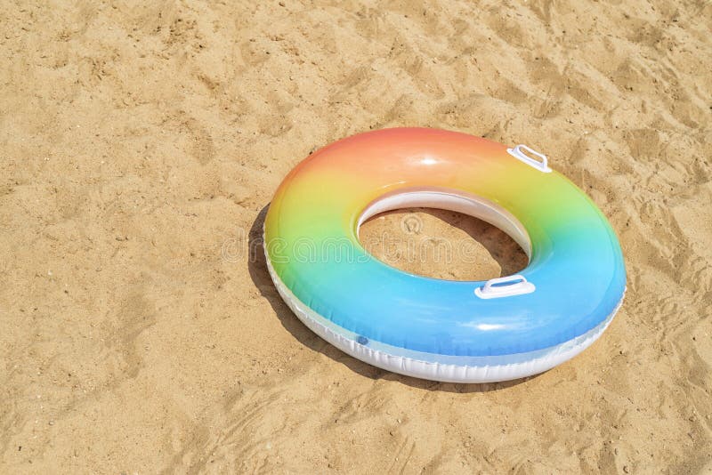Swim Tube or Rubber Ring on the Sand Stock Image - Image of tube ...