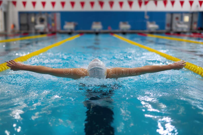 Swimmer in Action, Streamlined Pose, Deep Blue Pool, Bubbles, Front ...