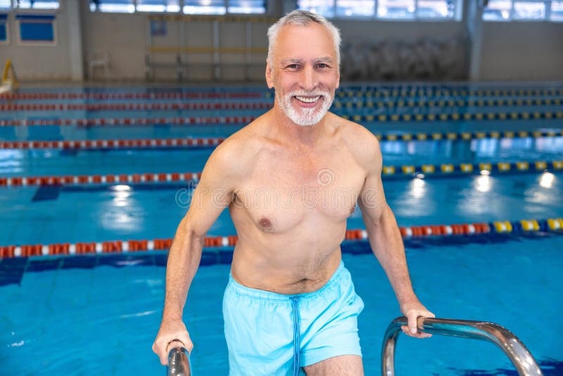 Bearded Gray-haired Man Getting Out of the Swimming Pool Stock Photo ...