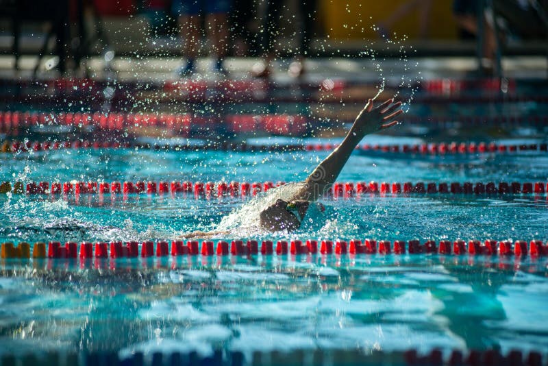 Swimmer Boy Swims Backstroke Swimming Style in the Pool Stock Photo ...