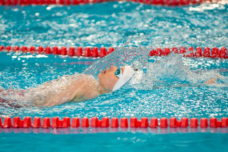 Swimmer Boy Swims Butterfly Swimming Style in the Pool Stock Photo ... Swimmer Boy Swims Butterfly Swimming Style in the Pool Stock Photo ...