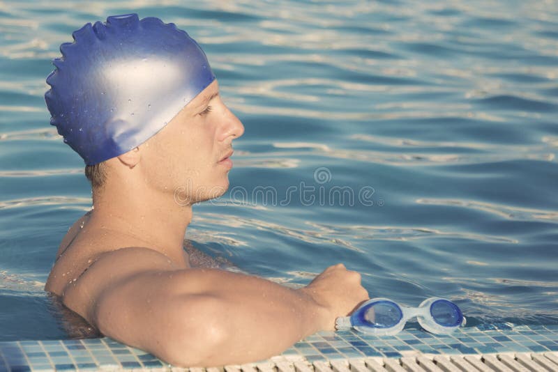 Swimmer holding goggles stock photo. Image of lifestyle - 70149370