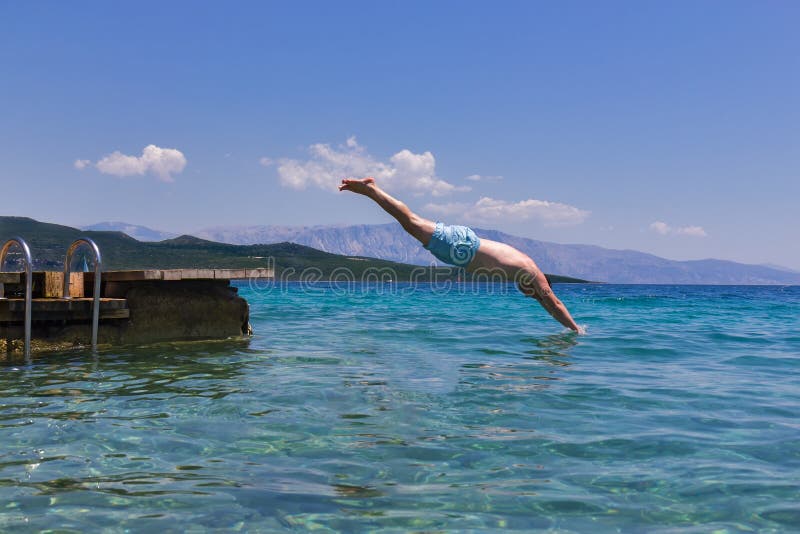 Swimmer Jumping To Sea Water Stock Image - Image of adult, sport: 88359705