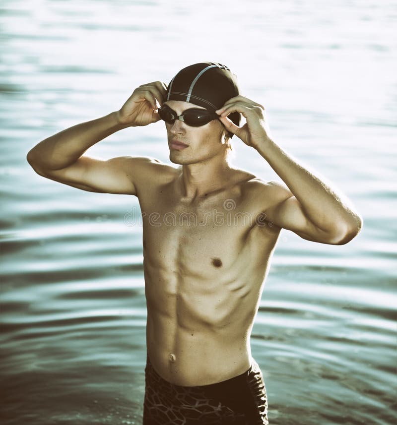 Swimmer model in a sea stock photo. Image of exercise - 129414932