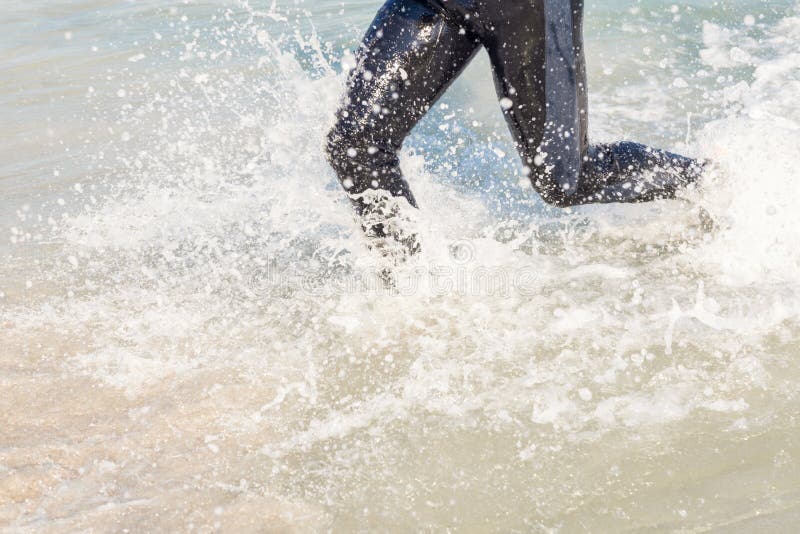 Swimmer Running in the Ocean Stock Photo - Image of healthy, ocean ...