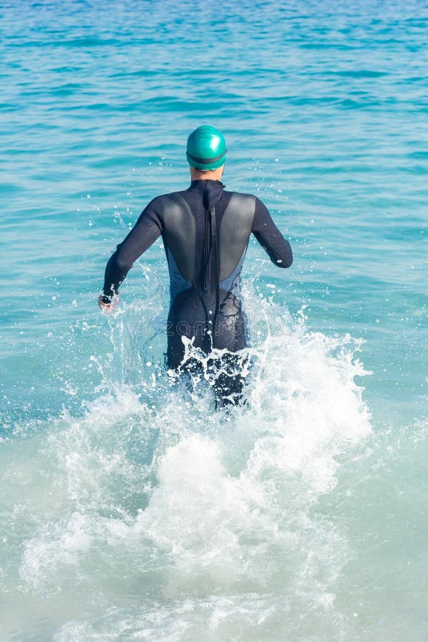 Swimmer Running in the Ocean Stock Photo - Image of running, sporty ...