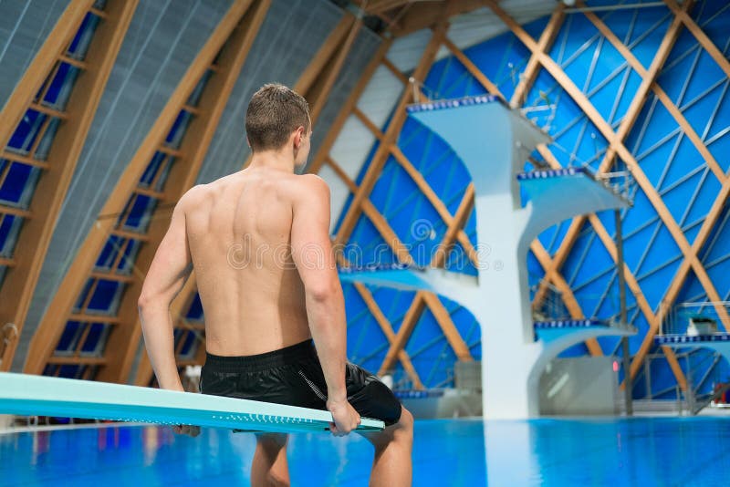 Swimmer Sits on a Platform for Diving Stock Photo - Image of beautiful ...